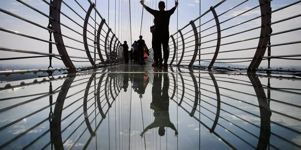 Tourists walked around the glass bridge at high height in the city of Jiangjin